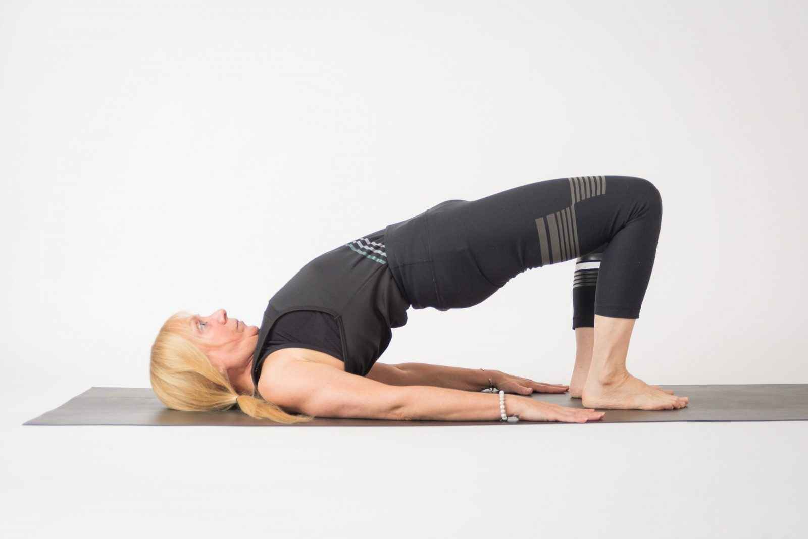 How to Do Bridge Pose in Yoga | Setubandha Sarvangasana - YogaCanada